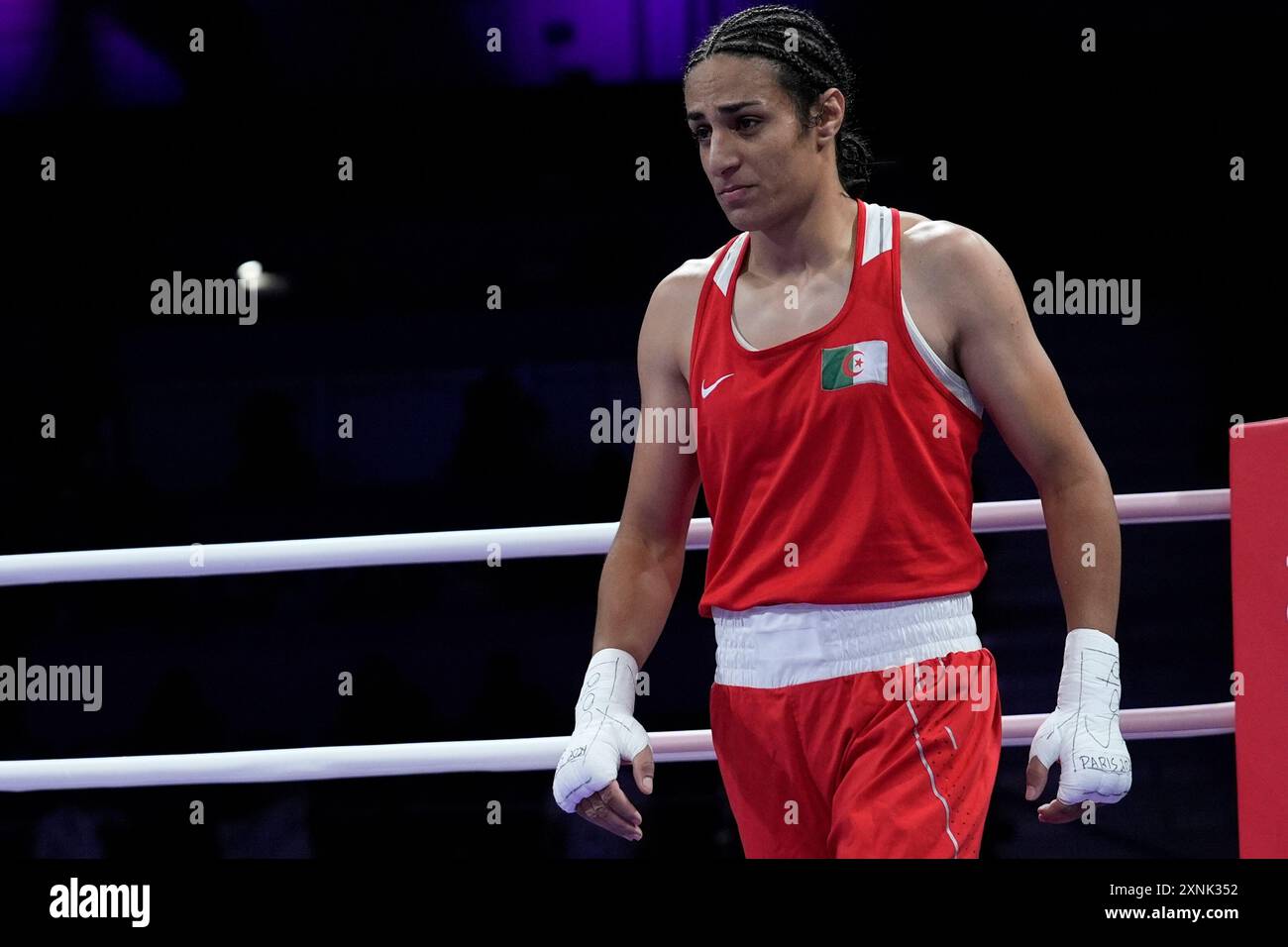 Algeria's Imane Khelif, reacts after defeating Italy's Angela Carini in ...