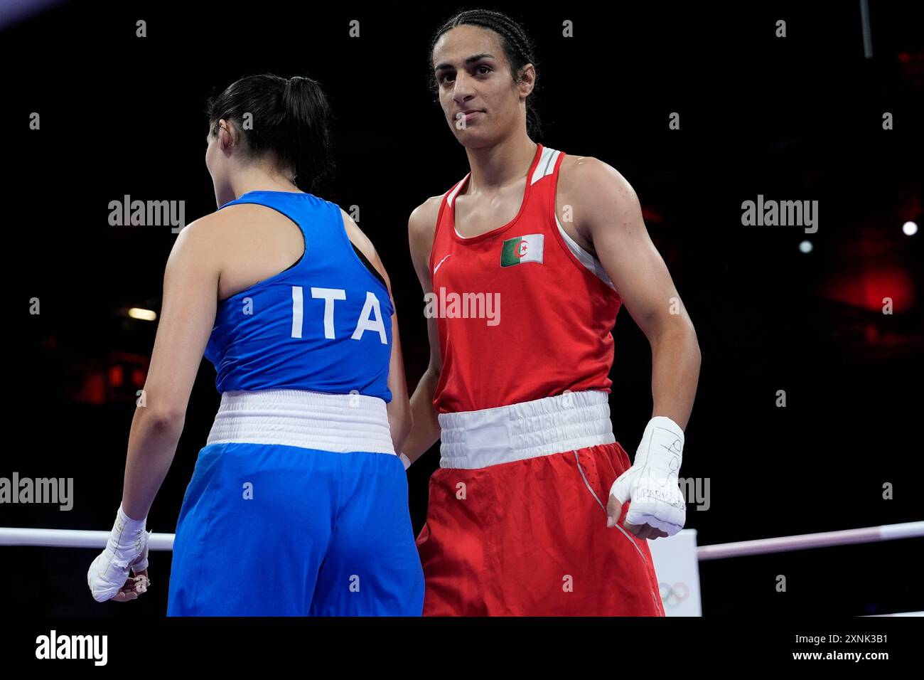 Algeria's Imane Khelif, right, after defeating Italy's Angela Carini ...