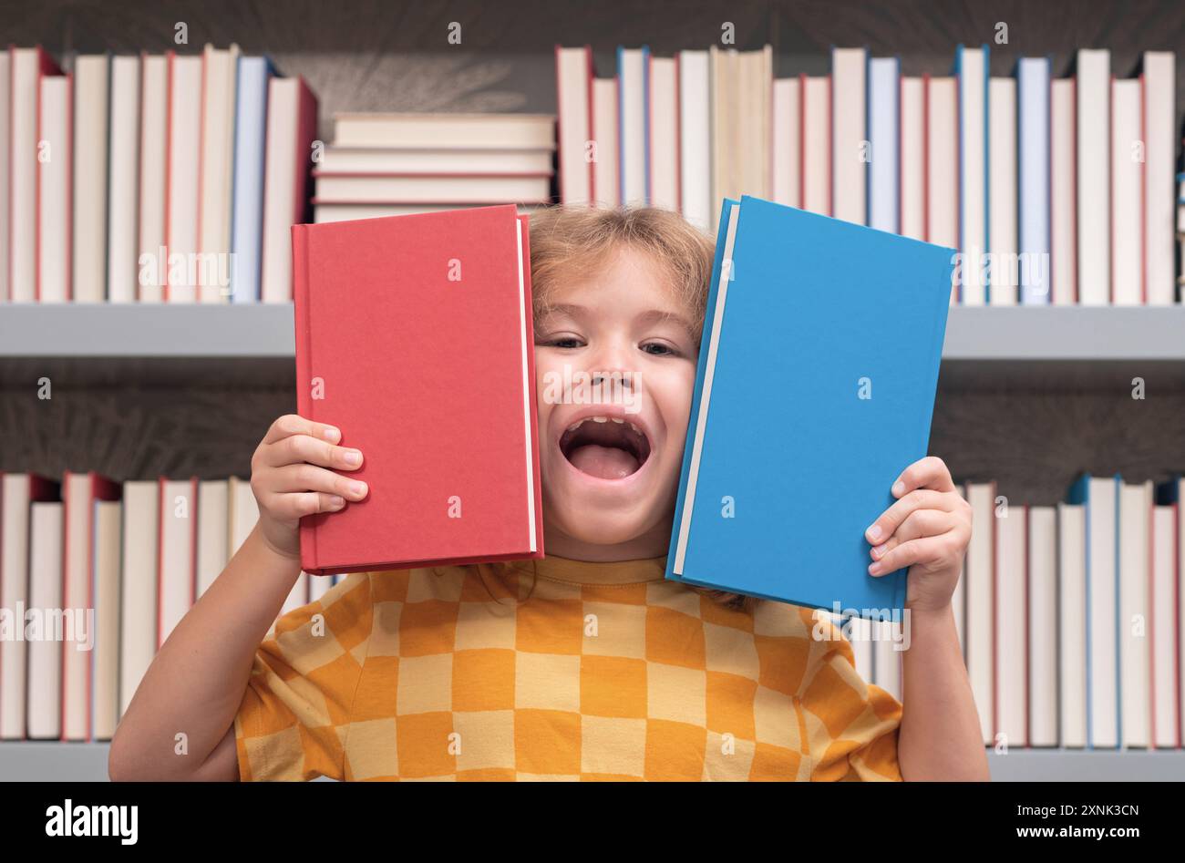 Excited school kid. School kid pupil studying in school library. Child ...