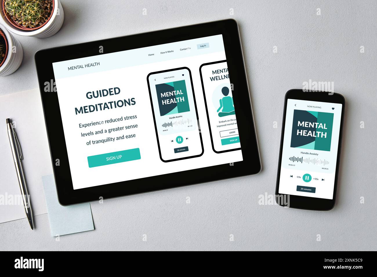 Meditation app on tablet and smartphone screen over gray table. Mental ...