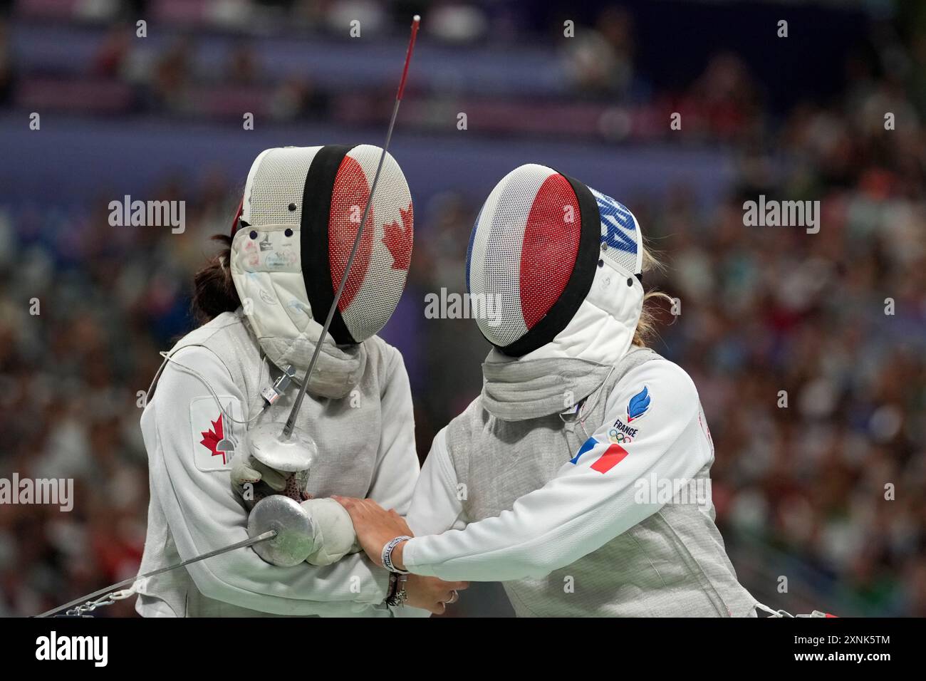 Canada's Jessica Zi Jia Guo, left, competes with France's Pauline ...