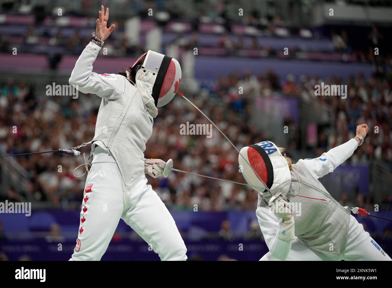 Canada's Jessica Zi Jia Guo, left, competes with France's Pauline ...