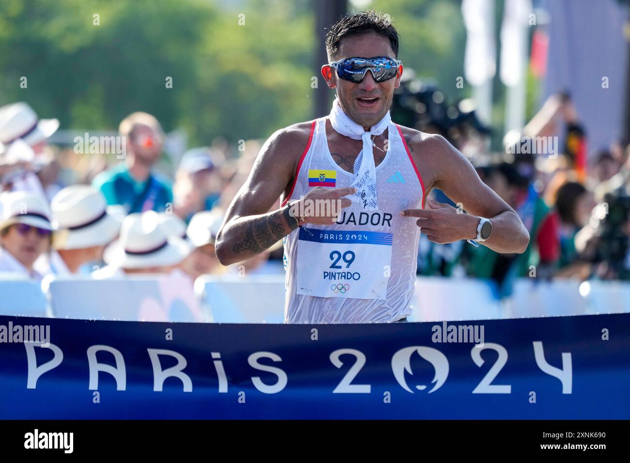 Brian Daniel Pintado of Team Ecuador, crosses the finish line of the men's 20km race walk to win ...