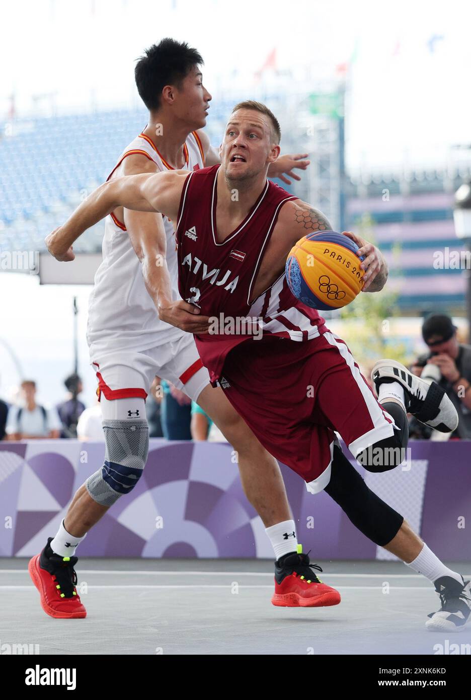 Paris, France. 1st Aug, 2024. Karlis Lasmanis (R) of Latvia breaks through during the 3x3 ...