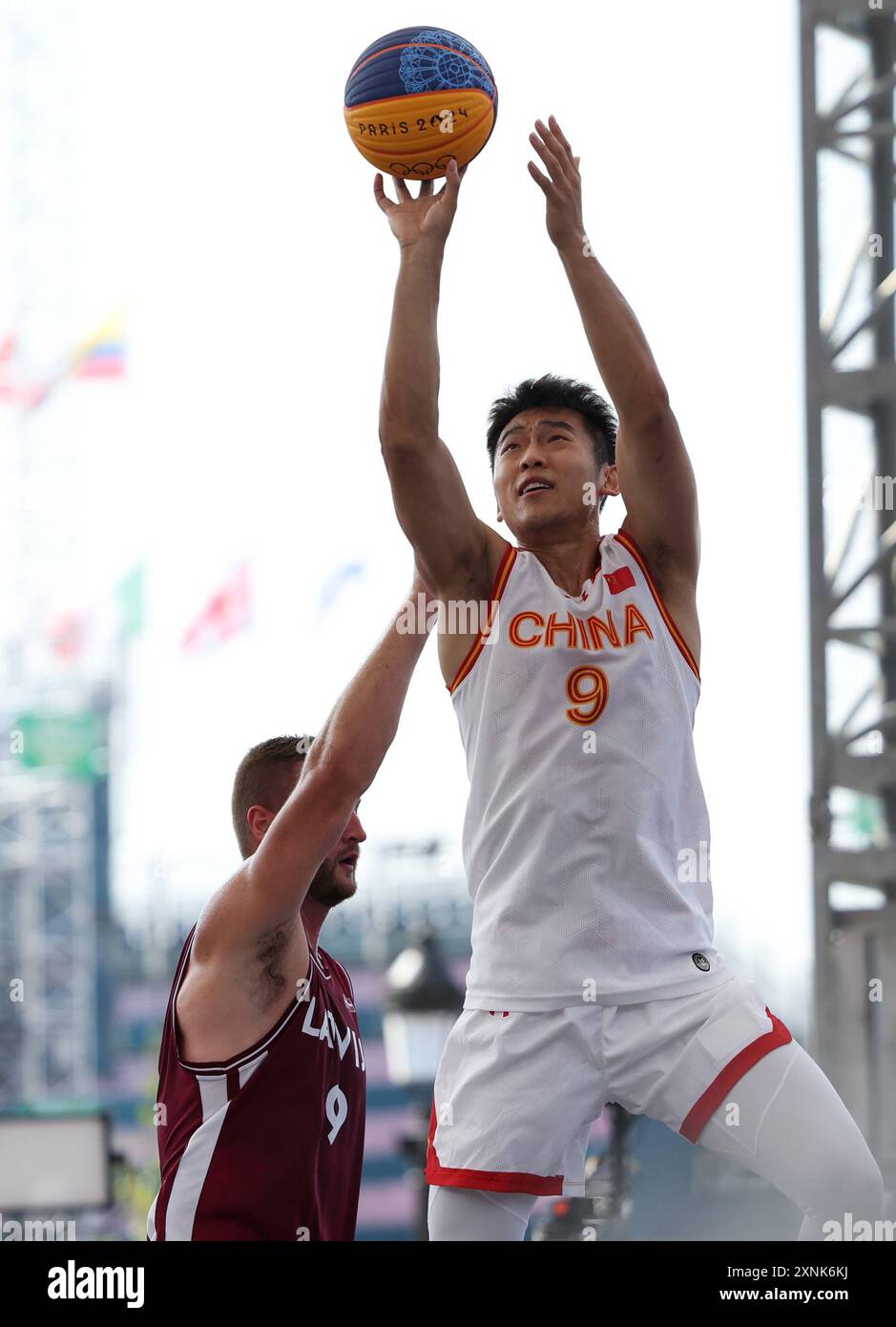 Paris, France. 1st Aug, 2024. Lu Wenbo (R) of China shoots during the 3x3 basketball men's pool ...
