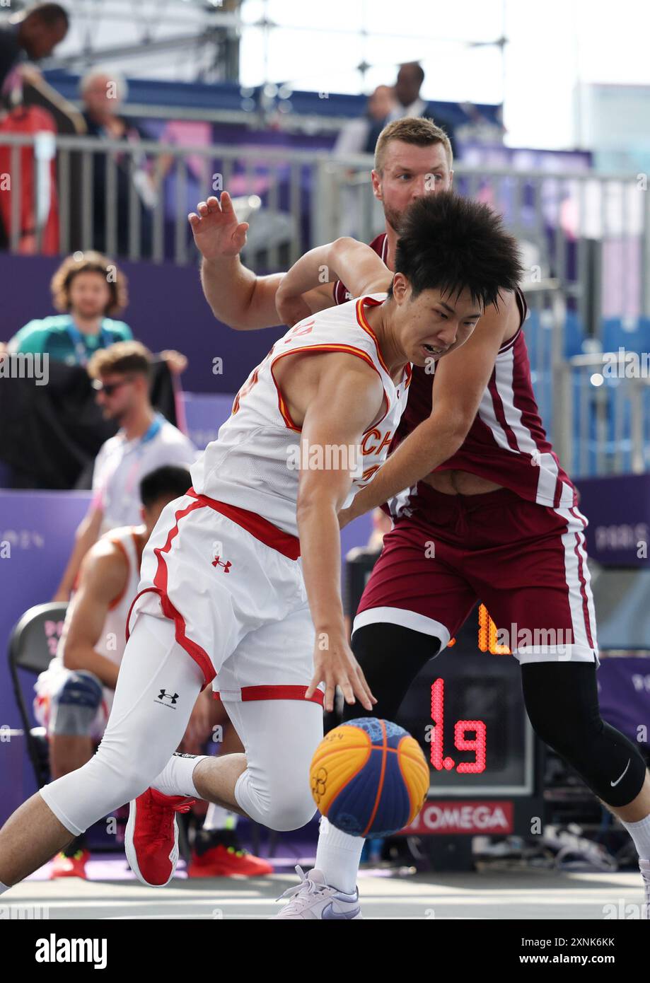 Paris, France. 1st Aug, 2024. Zhao Jiaren (front) of China breaks through during the 3x3 ...