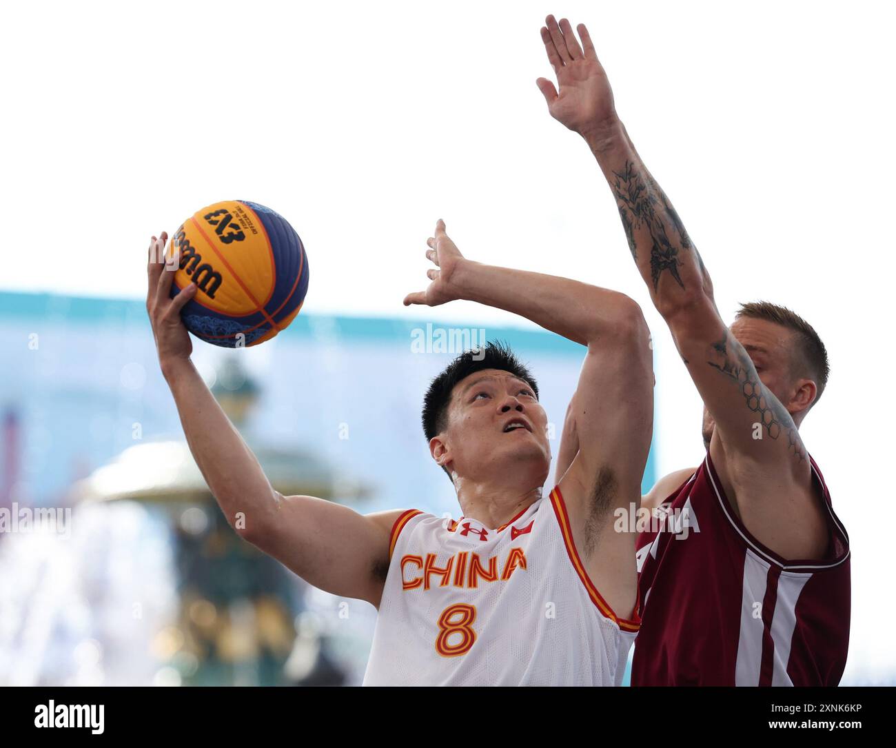Paris, France. 1st Aug, 2024. Zhang Ning (L) of China goes for a lay-up during the 3x3 ...