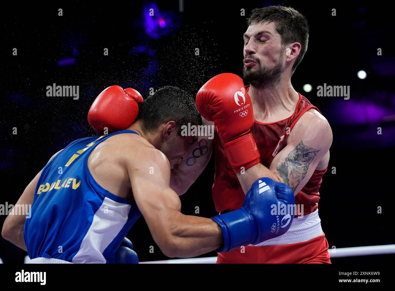 Canada's Wyatt Sanford, right, fights Uzbekistan's Ruslan Abdullaev in their men's 63.5kg ...