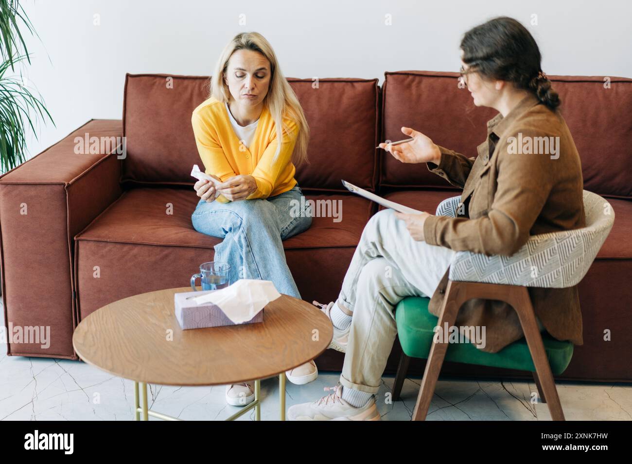 Psychological counseling scene. A psychologist conducts a session with ...