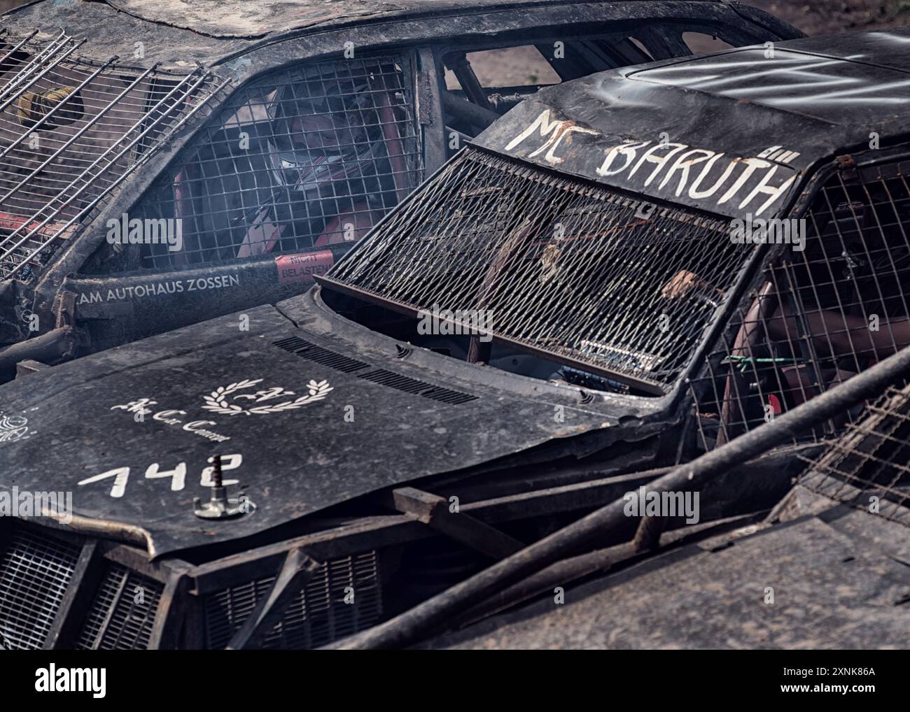 Start position in a demolition derby with heavily reinforced cars ready ...