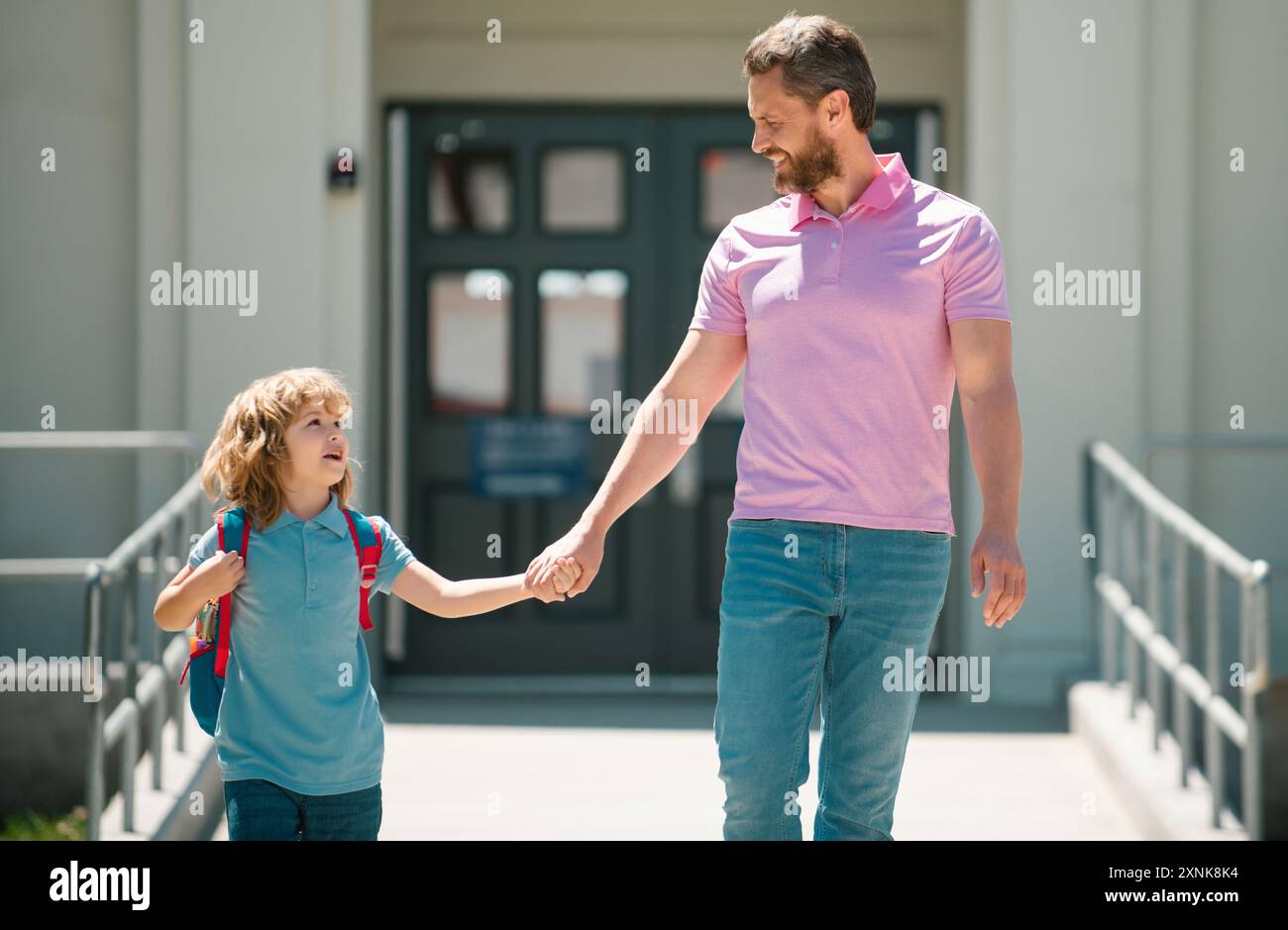 School boy going to school with father Stock Photo - Alamy