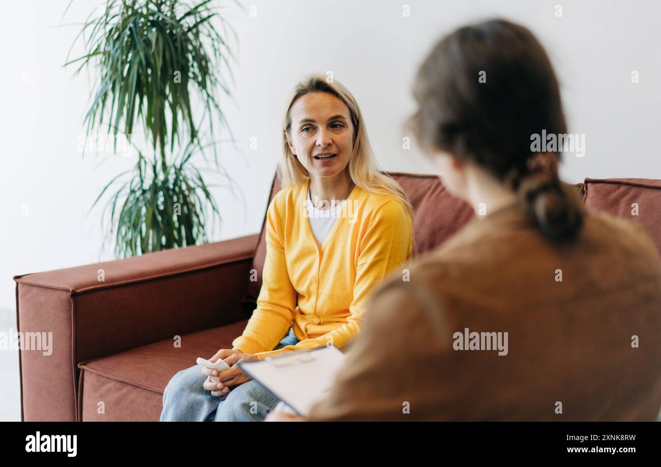 A young woman in a consultation with a professional psychologist ...