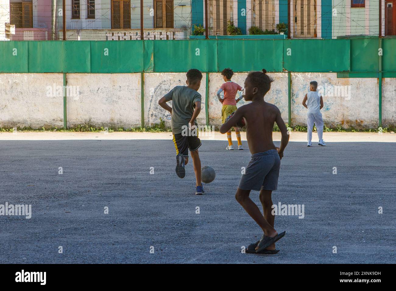 Cuban children playing soccer or football in public square Stock Photo ...