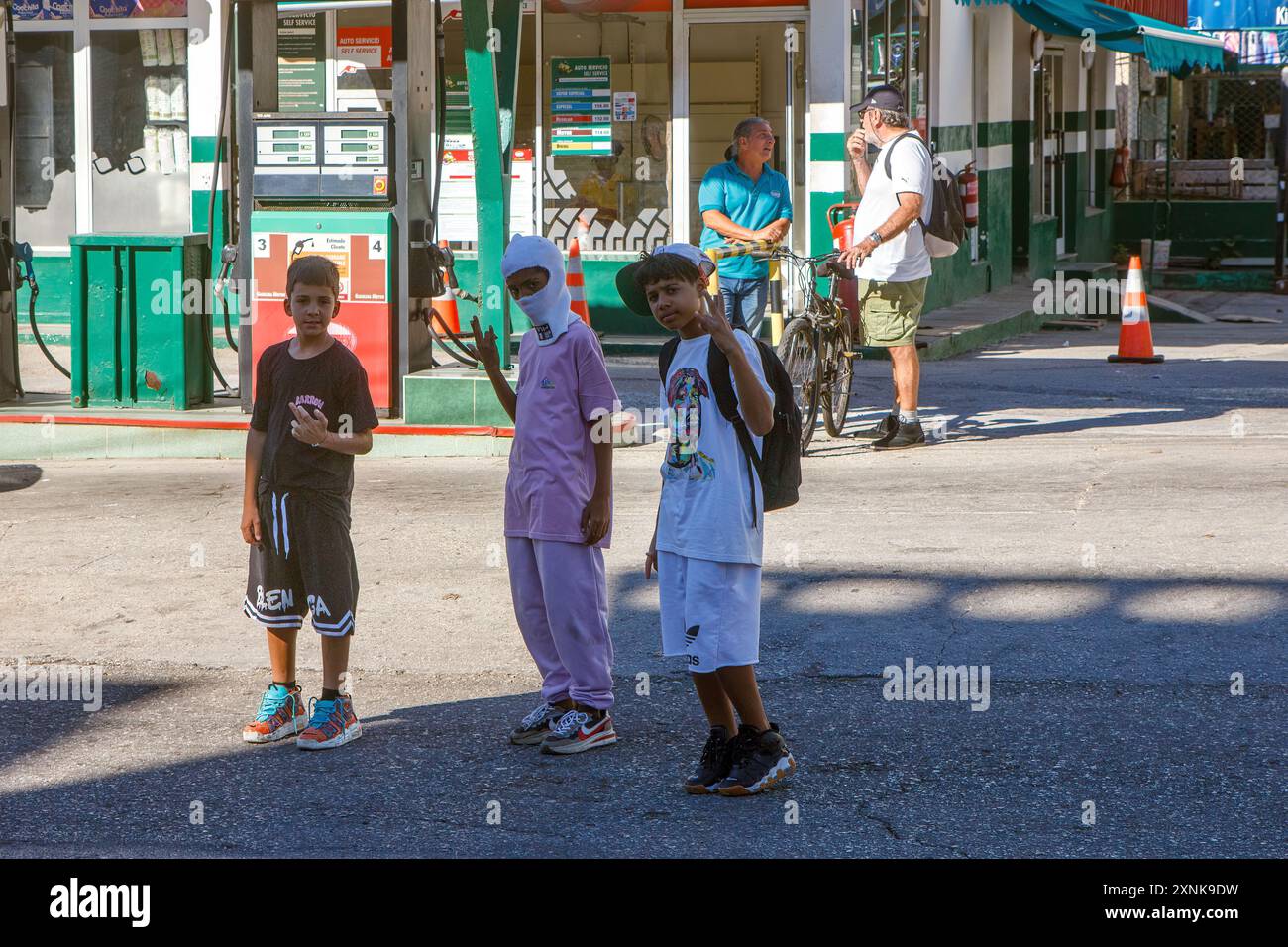 Three Cuban children on a city street Stock Photo - Alamy