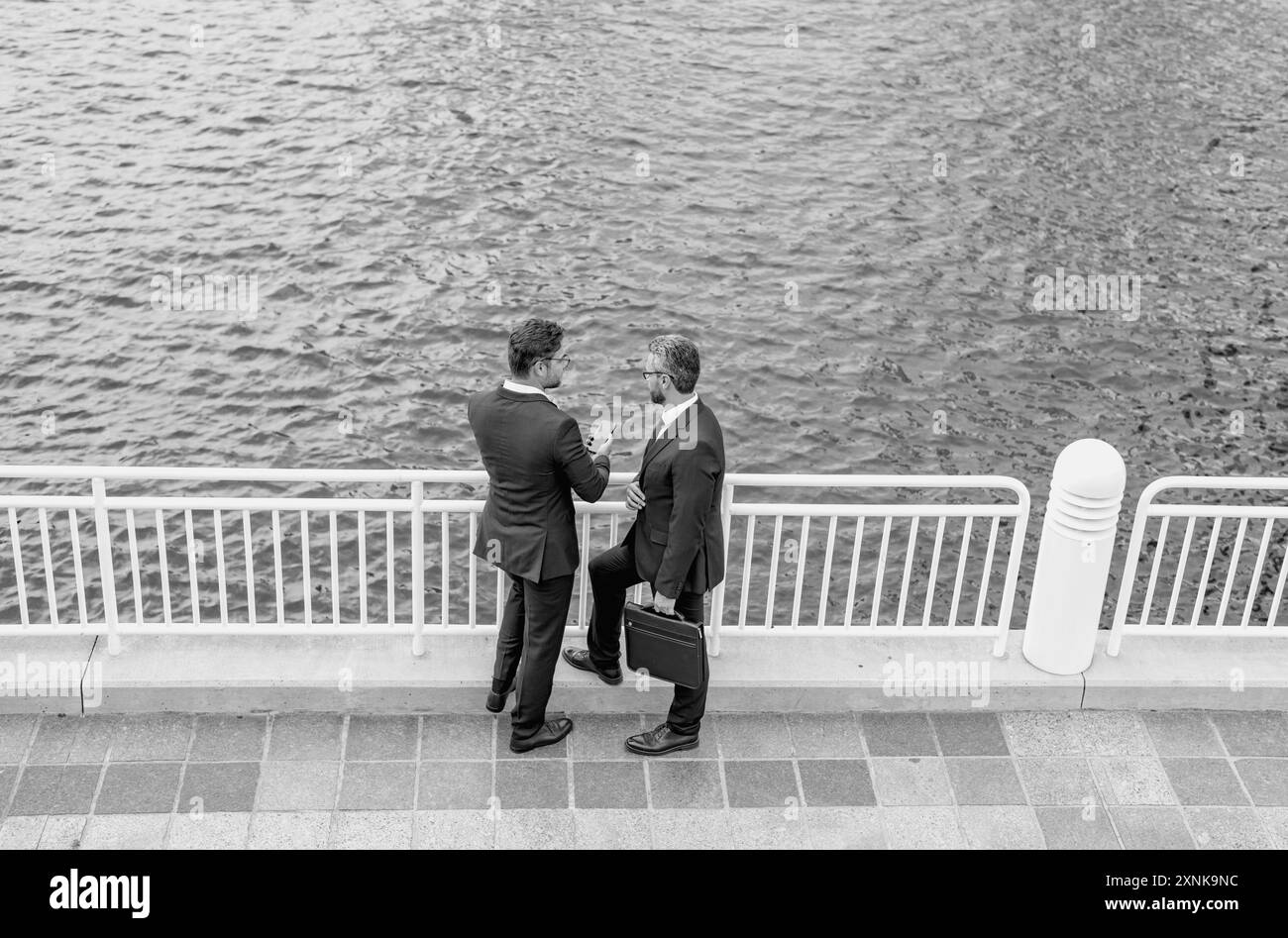 Serious conversation men Black and White Stock Photos & Images - Alamy