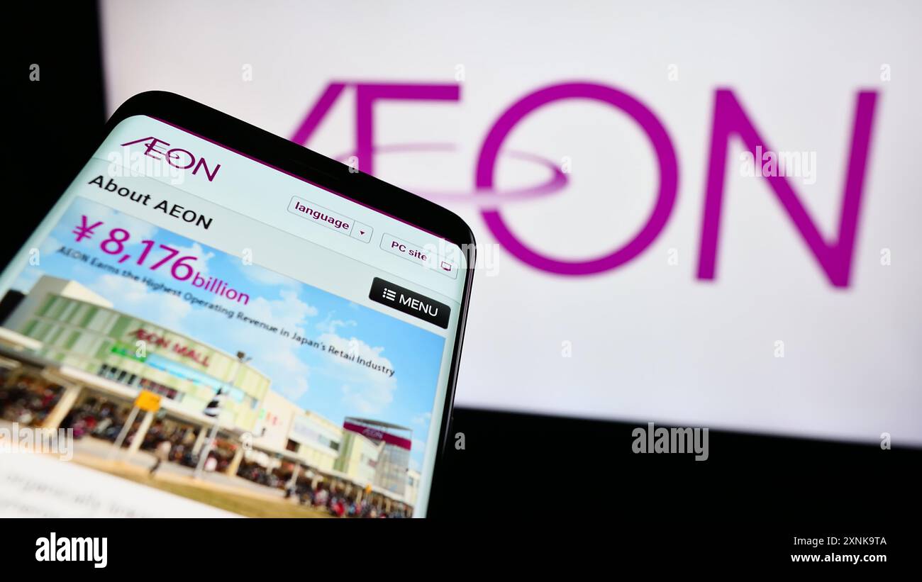 Mobile phone with website of Japanese retail holding company Aeon Co ...