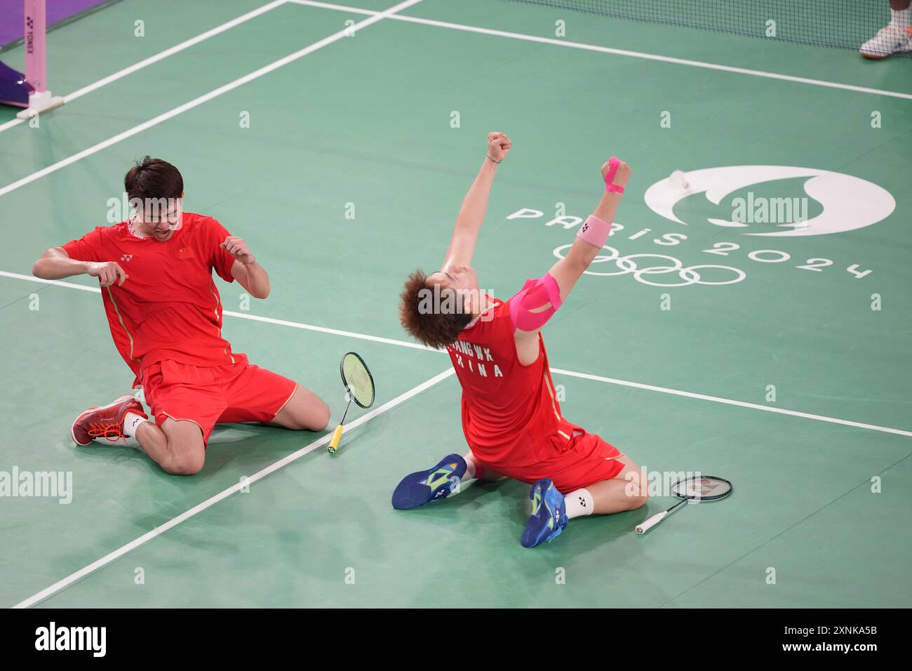 China's Liang Weikeng and Wang Chang celebrate after defeating Indonesia's Fajar Alfian and ...