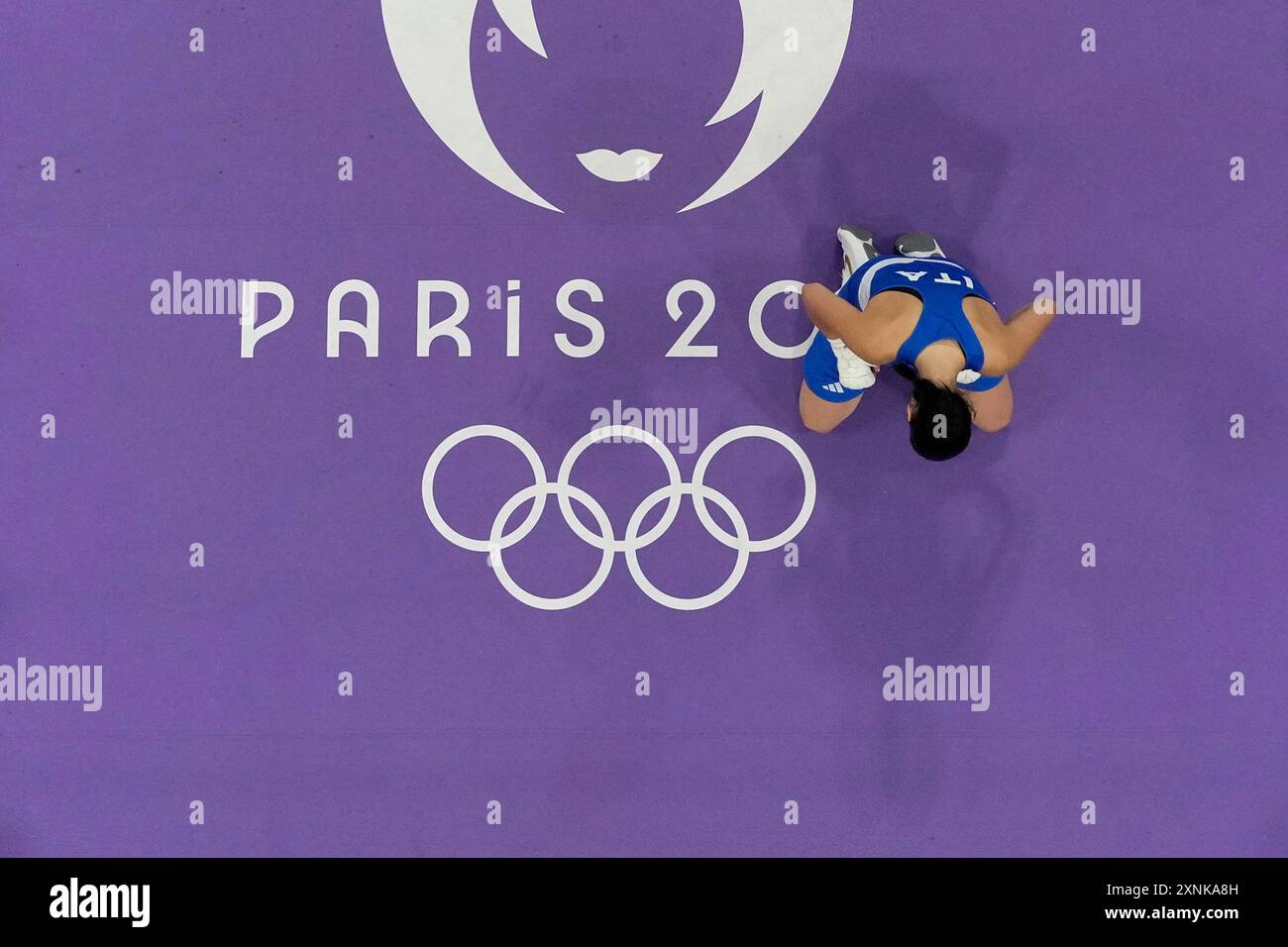 Italy's Angela Carini reacts after she abandoned her fight against ...