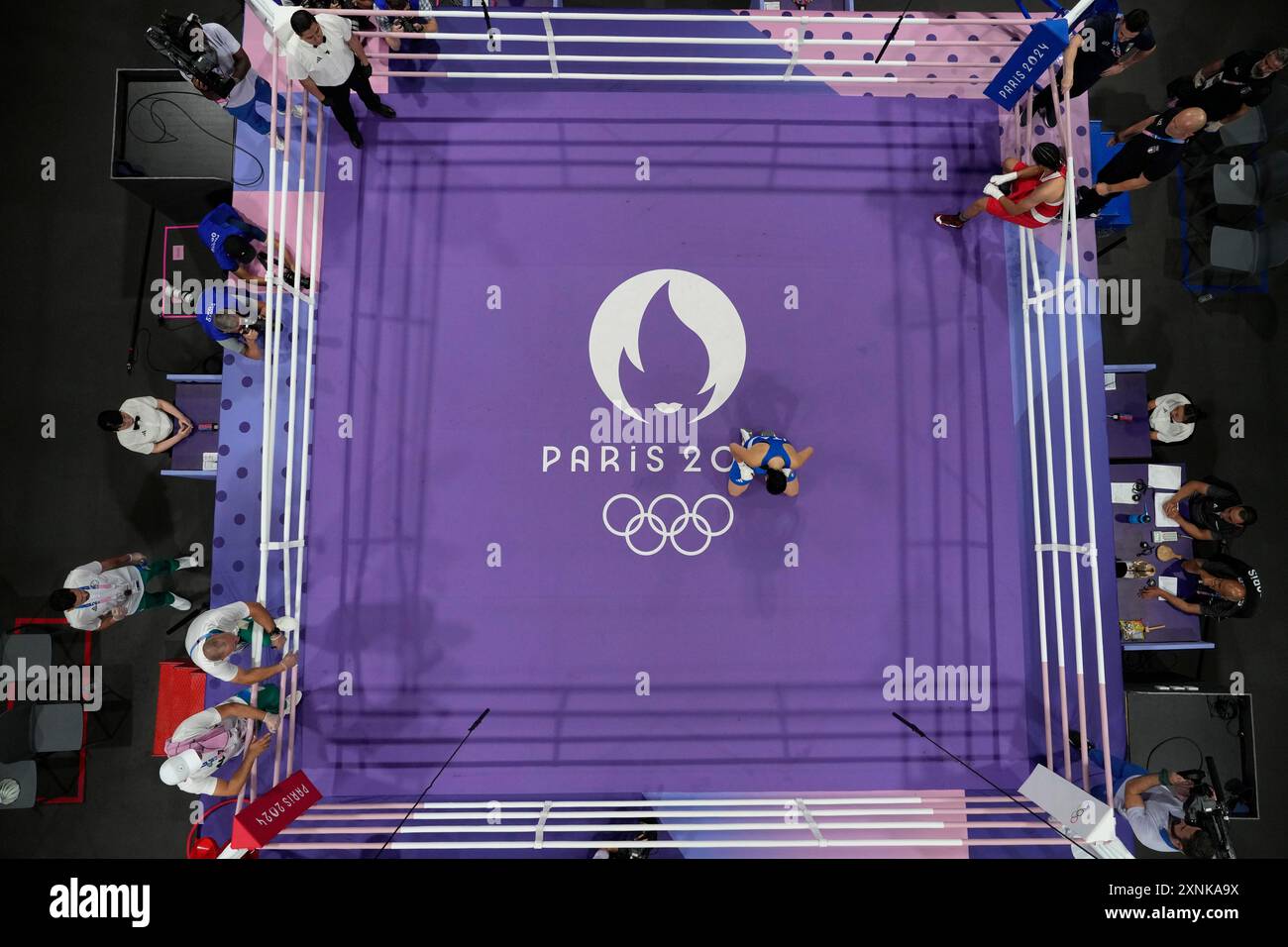 Italy's Angela Carini, center, reacts after she abandoned her fight ...