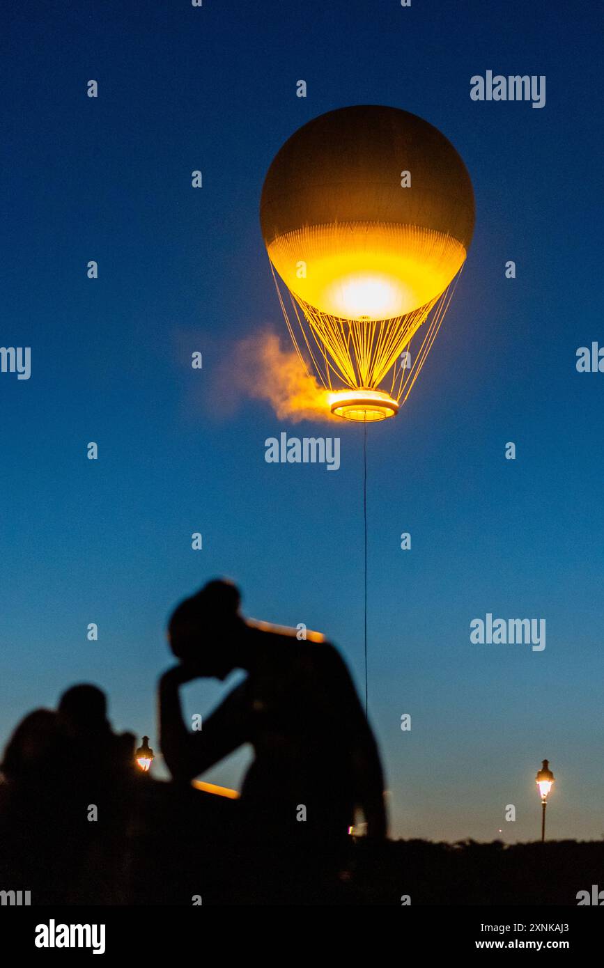The Olympic cauldron rises every evening after sunset in a giant ...