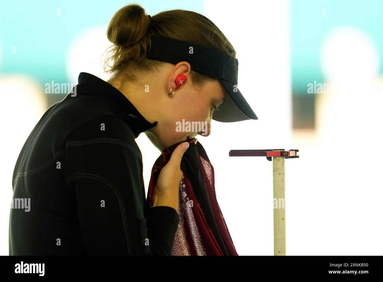 Denmark's Stephanie Laura Scurrah Grundsoee wipes her mouth with a ...