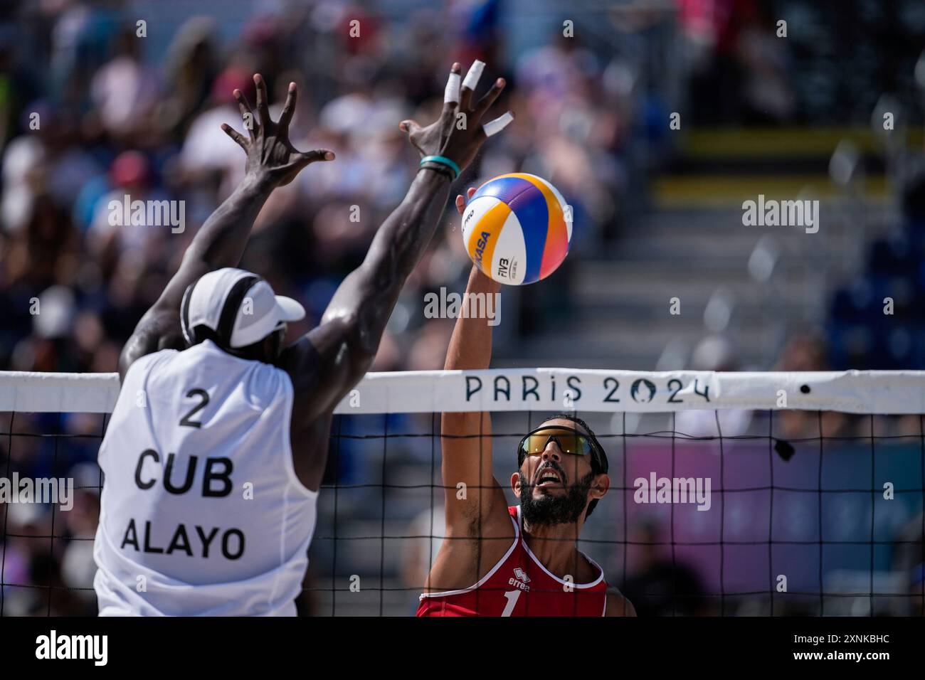 Morocco's Mohammed Abicha hits the ball during the men's pool A beach ...