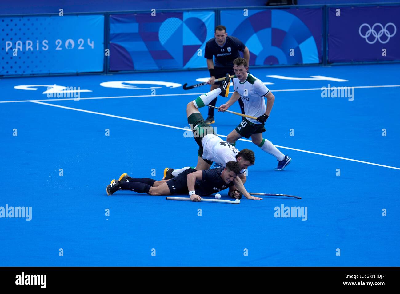 Argentina's Juan Catan, bottom, collides with Ireland's Benjamin Walker ...