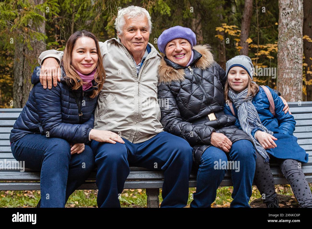 Happy family walking in fall park outdoor Stock Photo - Alamy