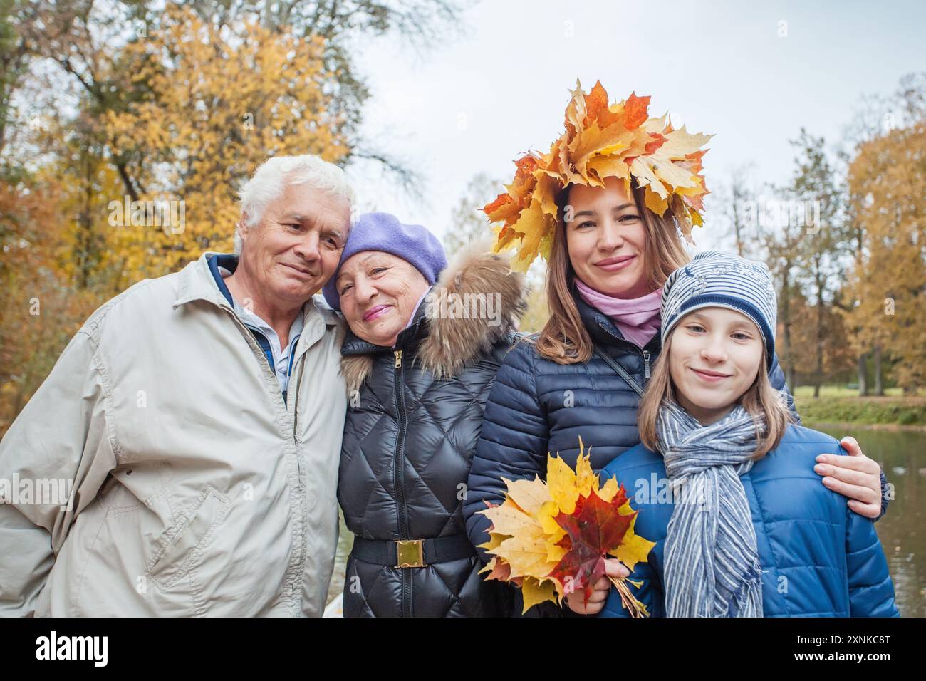 Happy multi-generation family in autumn park, outdoor portrait Stock ...