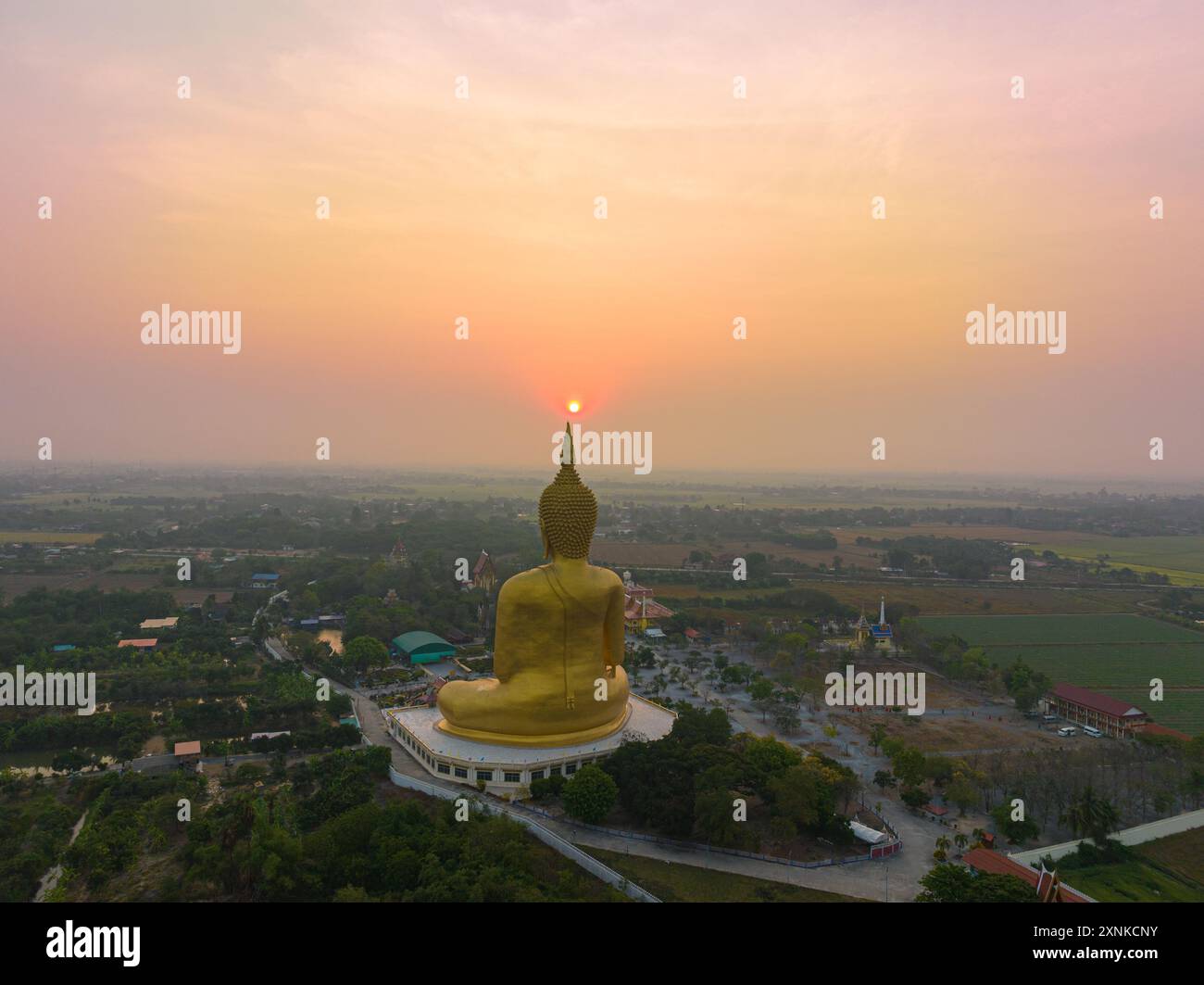 aerial view The sun was above the head of the biggest golden Buddha in ...