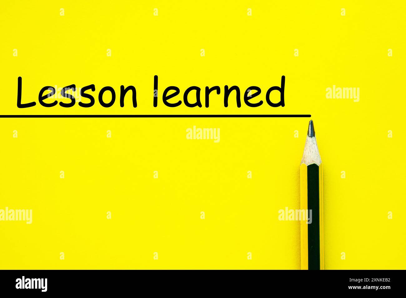 Lesson learned written on yellow paper background Stock Photo - Alamy
