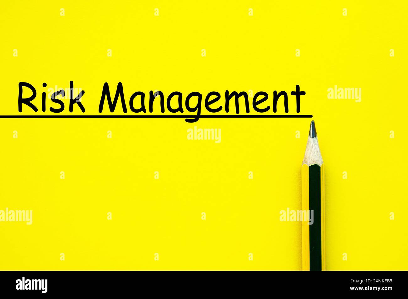 Risk management text written on yellow paper background Stock Photo - Alamy