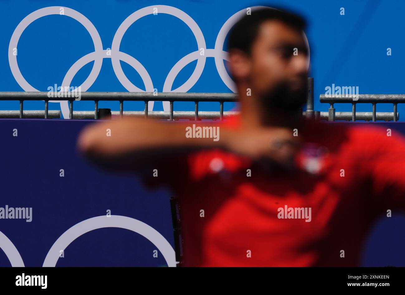 Egypt's Youssof Tolba shoots with the Olympic rings behind him during ...