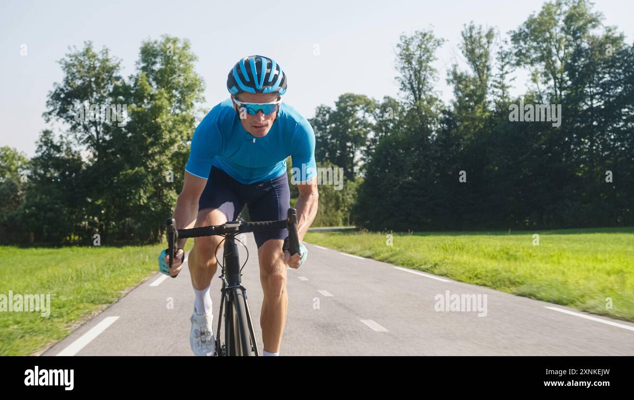 Muscular man, professional racing bicyclist sprint cycling, with ...