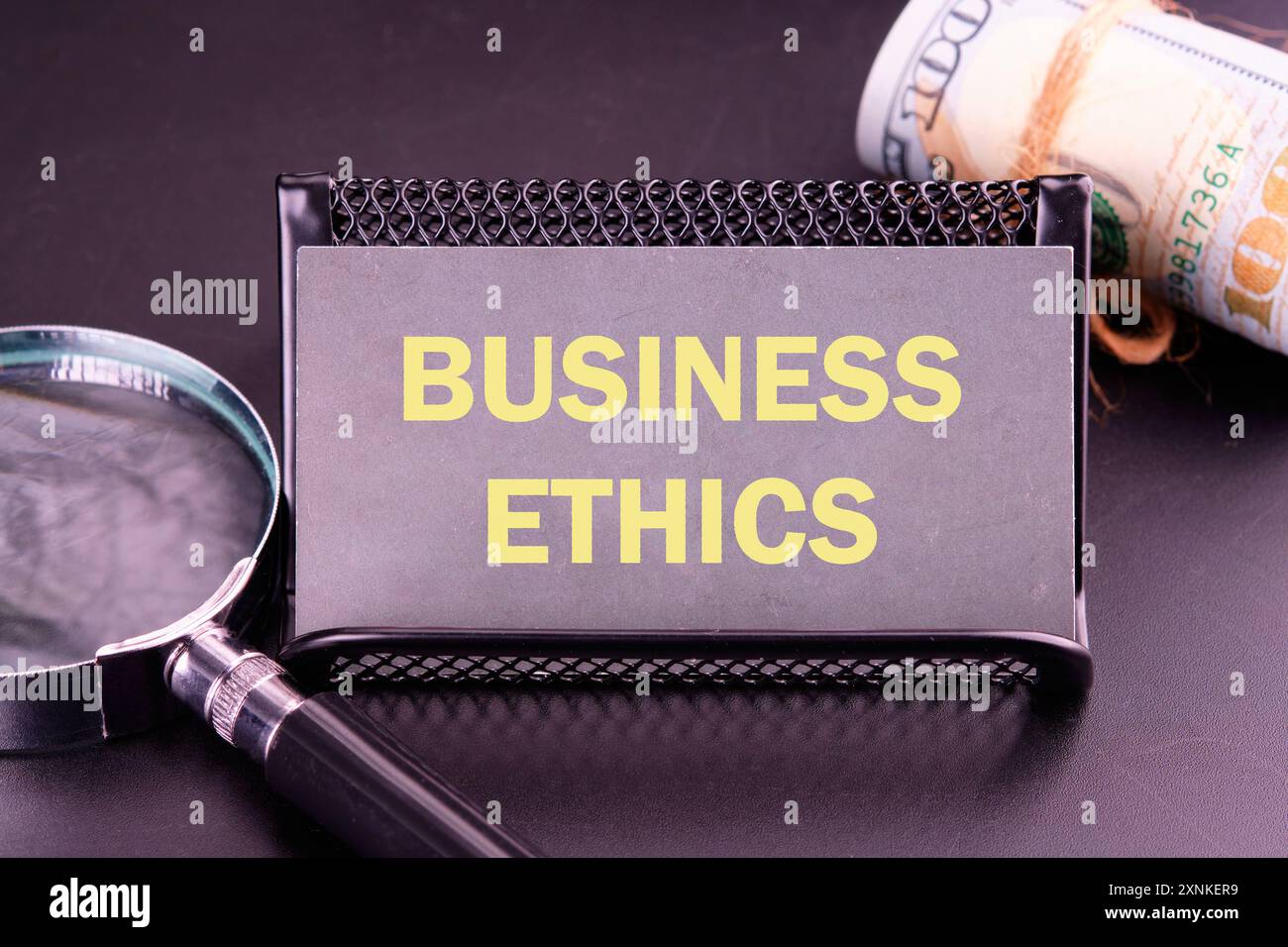 BUSINESS ETHICS written on the business card Stock Photo - Alamy
