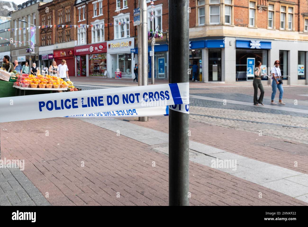 Crime scene incident tape at the scene of a knife crime and antisocial ...