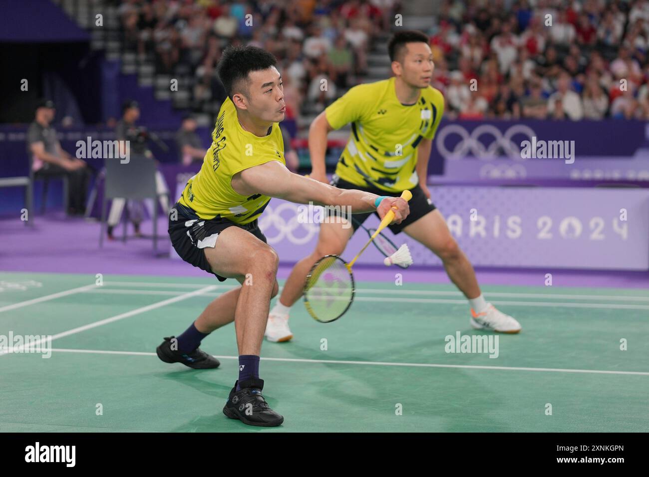 Taiwan's Lee Yang and Wang Chi-Lin play against Thailand's Supak Jomkoh ...
