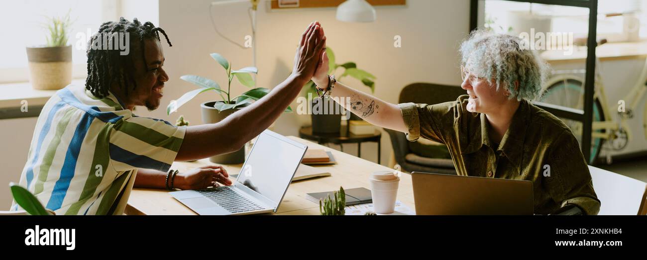 Successful gen Z Black man and Caucasian woman with disability doing ...