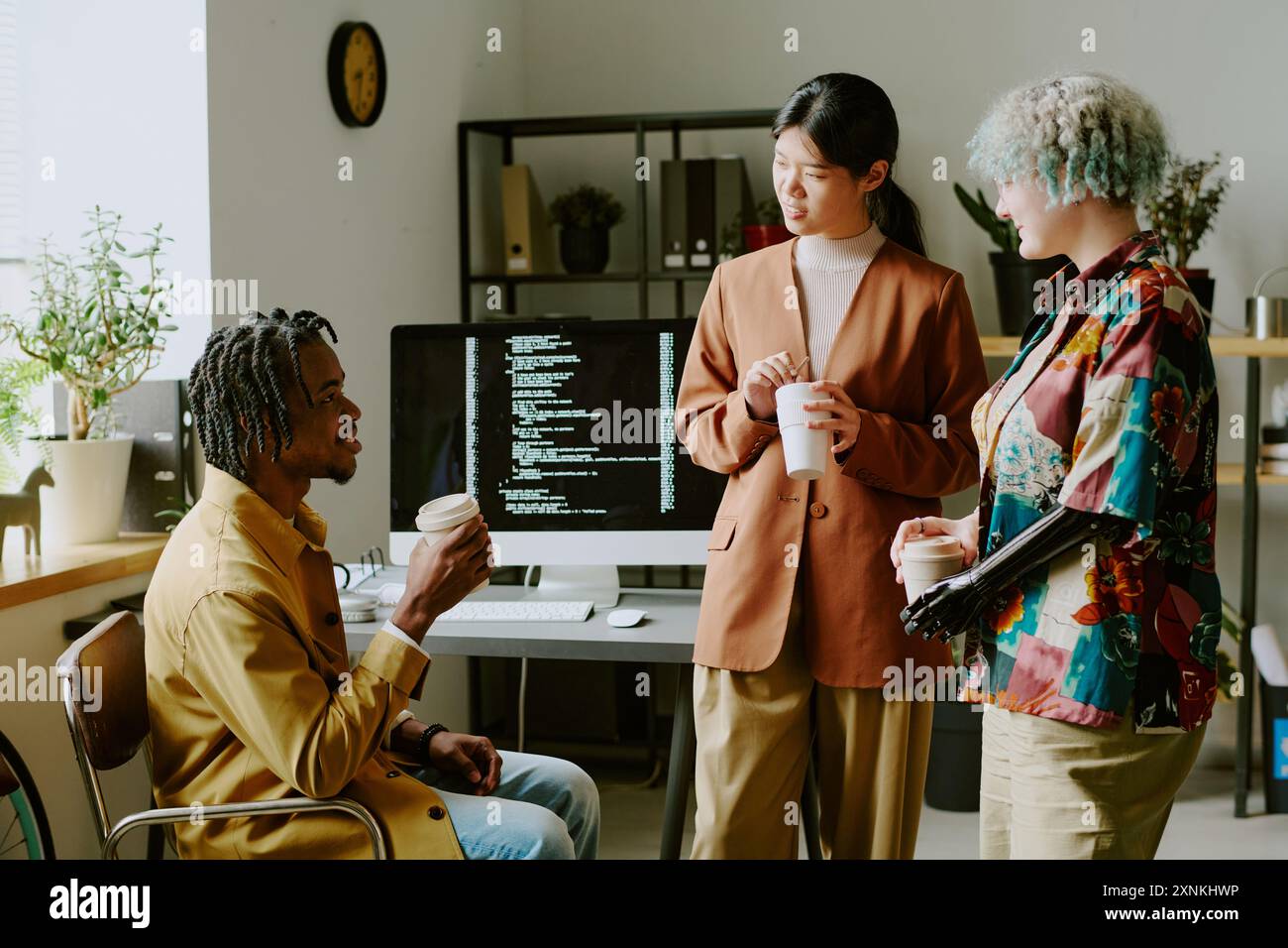 Group of three diverse gen Z colleagues wearing stylish outfits ...