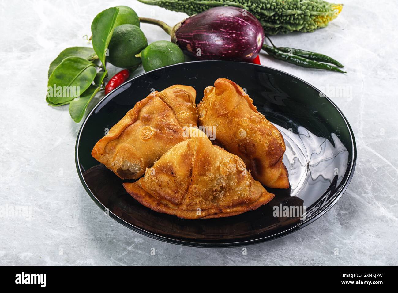 Indian cuisine - fries crispy stuffed samosa Stock Photo - Alamy