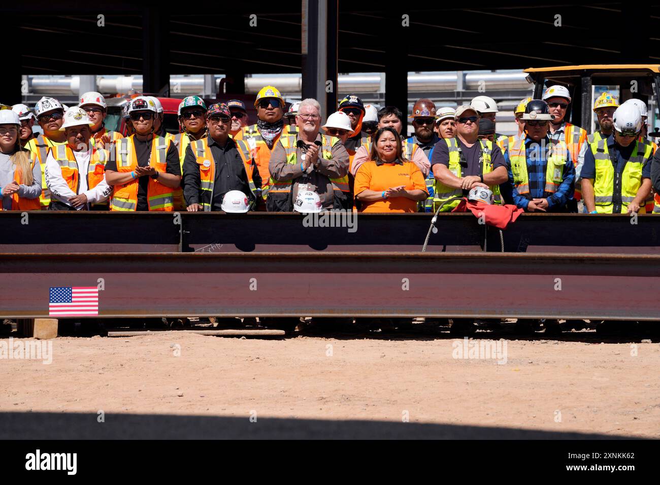 FILE - Workers listen as President Joe Biden speaks on March 20, 2024 ...
