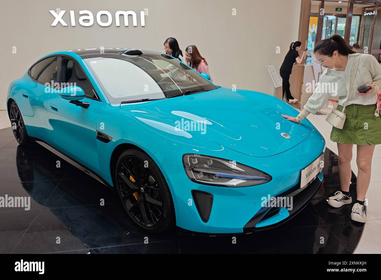 SHANGHAI, CHINA - AUGUST 1, 2024 - Customers experience the Xiaomi SU7 ...