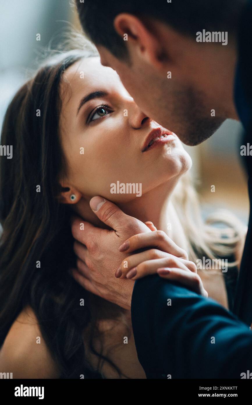 girl and guy cuddle each other for a kiss Stock Photo - Alamy