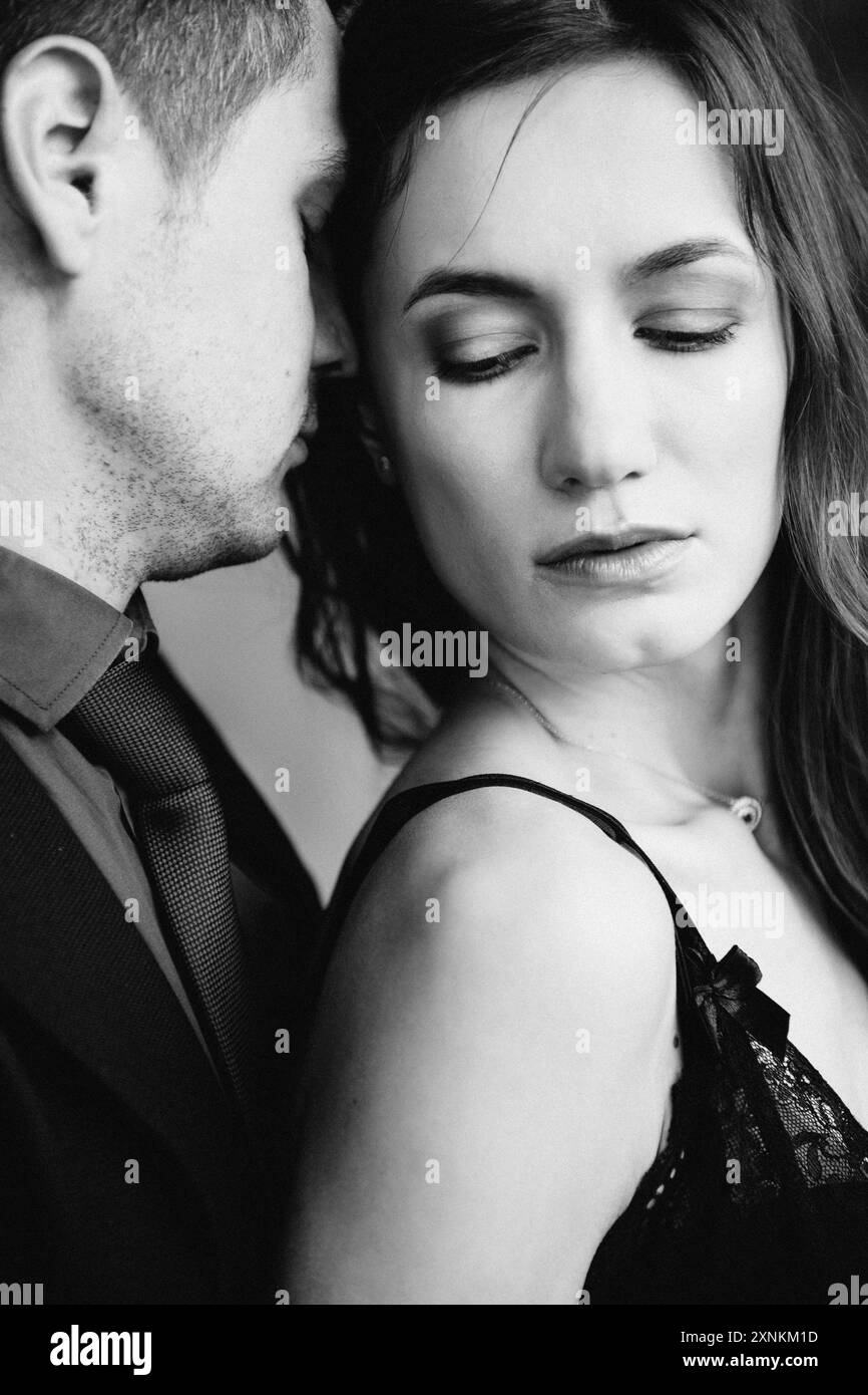 Man behind woman bed Black and White Stock Photos & Images - Alamy