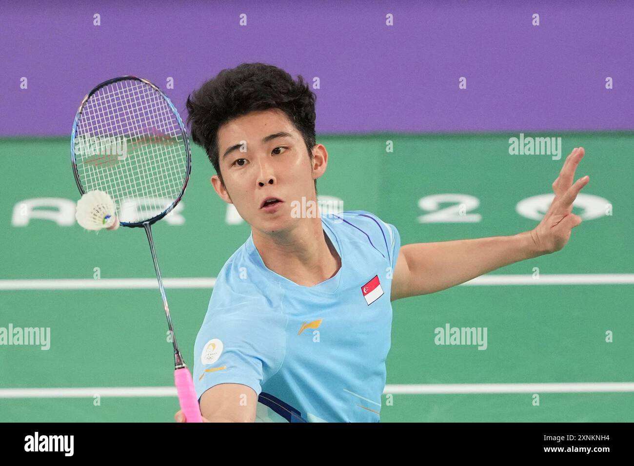 Singapore's Loh Kean Yew plays against China's Li Shifeng during their ...