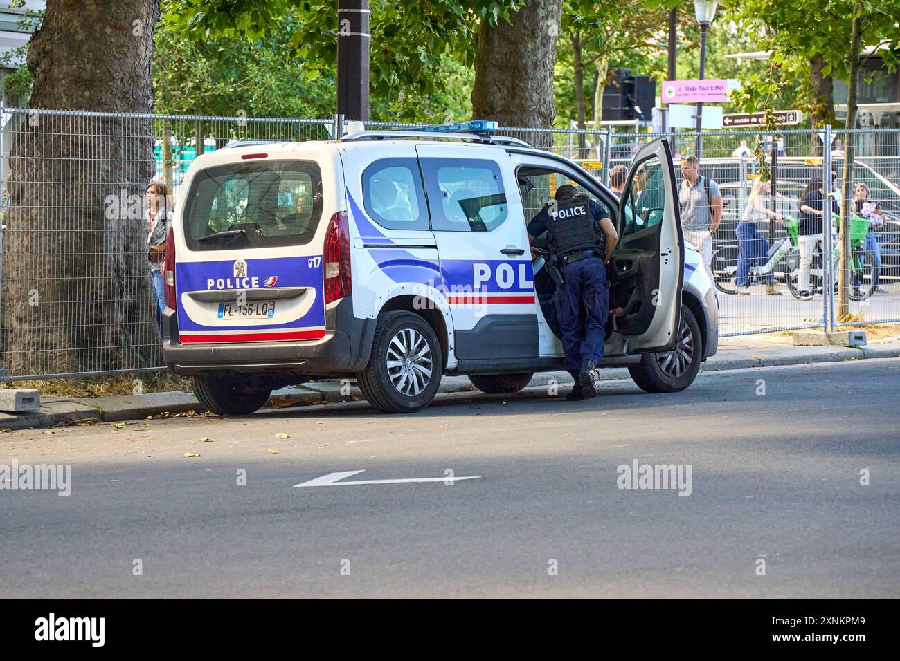 Paris, France - July 13, 2024: A French police car with a policeman on ...