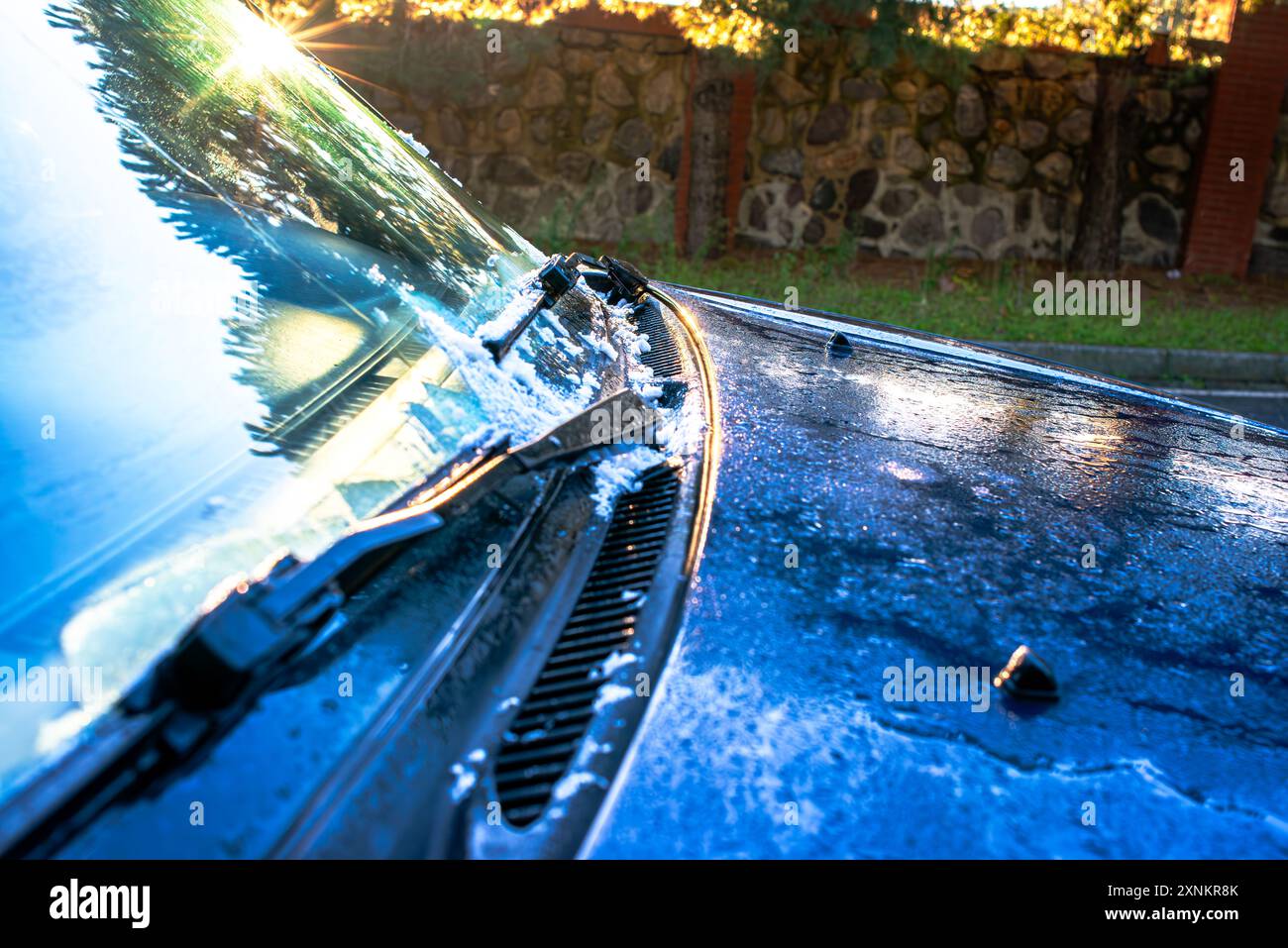 A photo capturing the melted ice on the surface of an SUV car in the ...