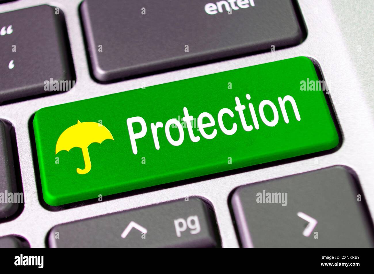 Protection text on green keyboard with umbrella symbol Stock Photo - Alamy