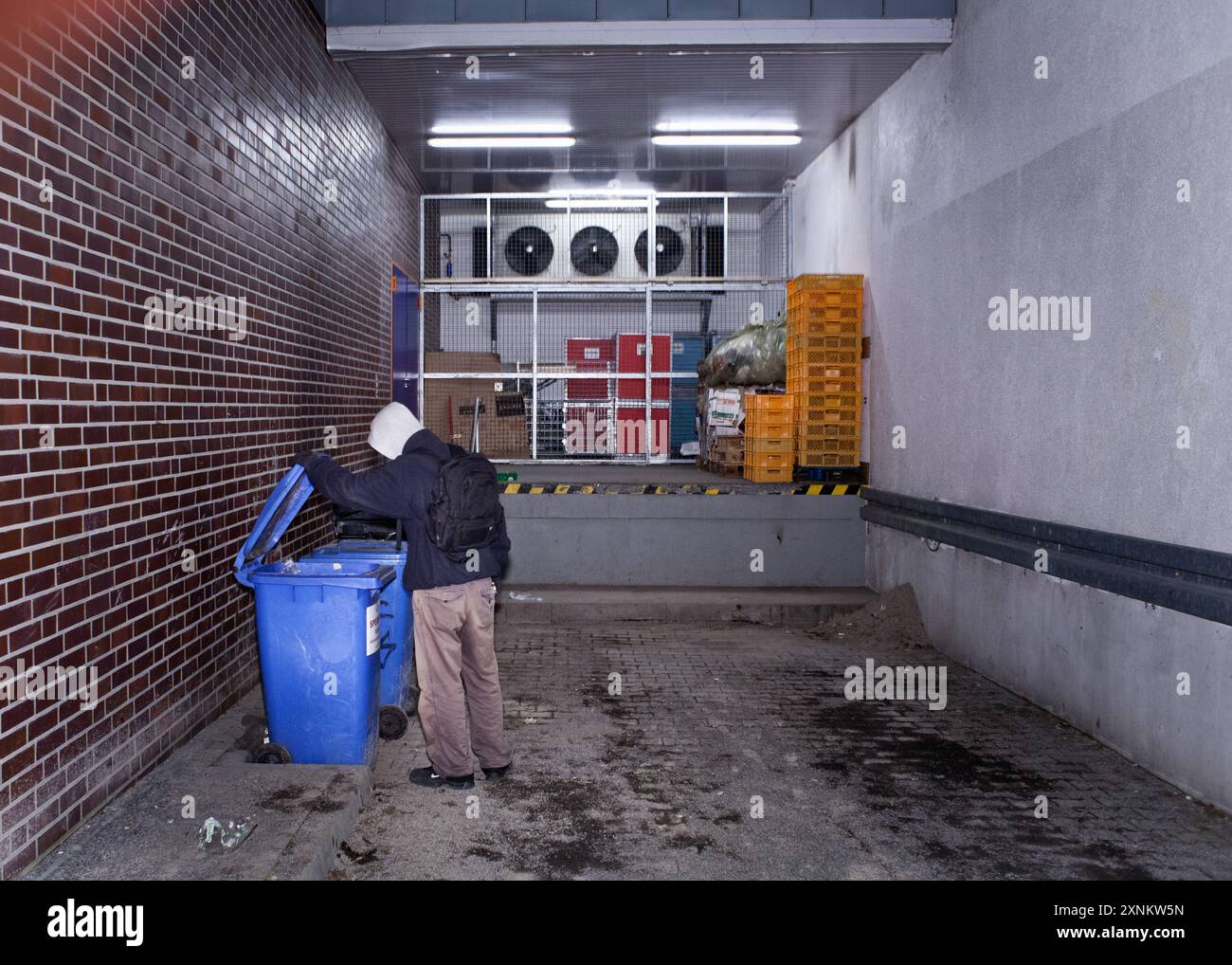 A student rummages through supermarket dumpsters for usable food and ...