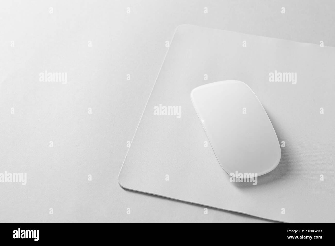 Wireless mouse and mousepad on white background, space for text Stock ...